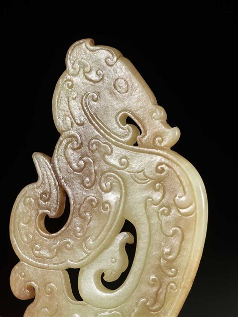 Lot 1052 An Archaistic Yellow Jade ‘dragon And