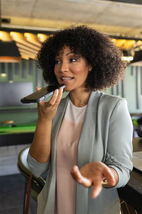 Speaking Into Smartphone Businesswoman Using Voice Assistant In Modern