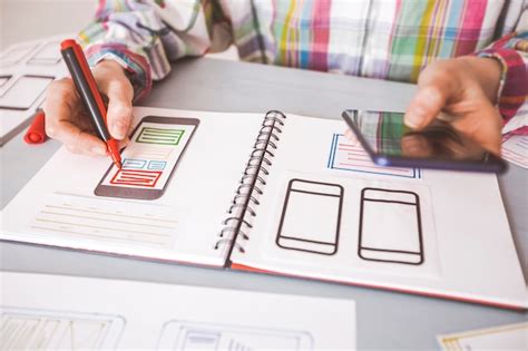 Premium Photo Developer Designing User Interfaces For Mobile Phone