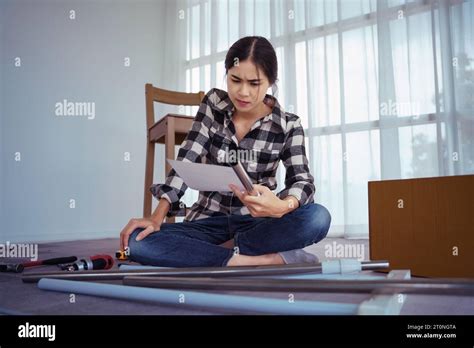 Women Stressful While Reading Installation Manual And Instruction