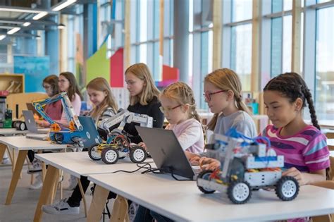 Girls Exploring Robotics In School Premium Ai Generated Image