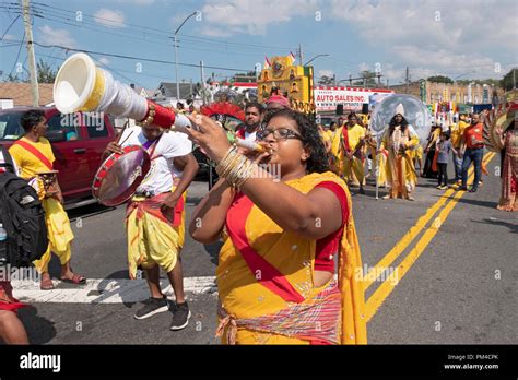 A Hindu Marcher Blowing A Shehenai Horn At The 2018 Madrassi Parade On