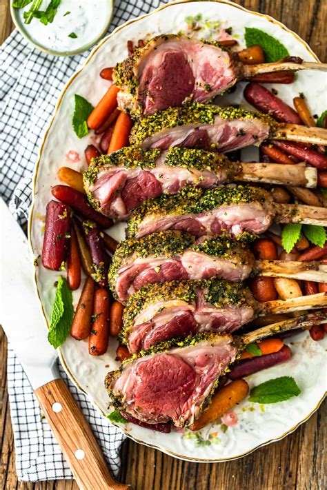 Roast Rack Of Lamb On A Plate Of Carrots Lamb Recipes Crusted Rack