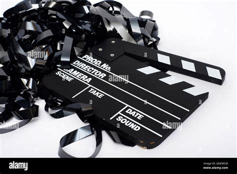Movie Clapper Board With Video Tape On White Background Stock Photo Alamy