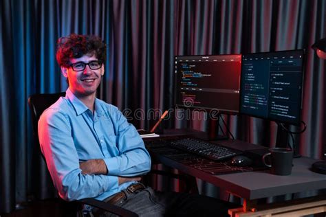 Profile Of It Developer Sitting Against On Software Codding Monitor