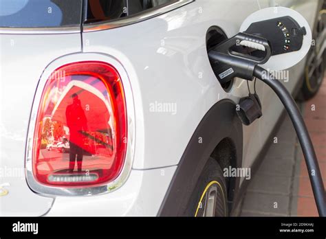 At The Charging Station With The Electric Mini Cooper SE Stock Photo Alamy