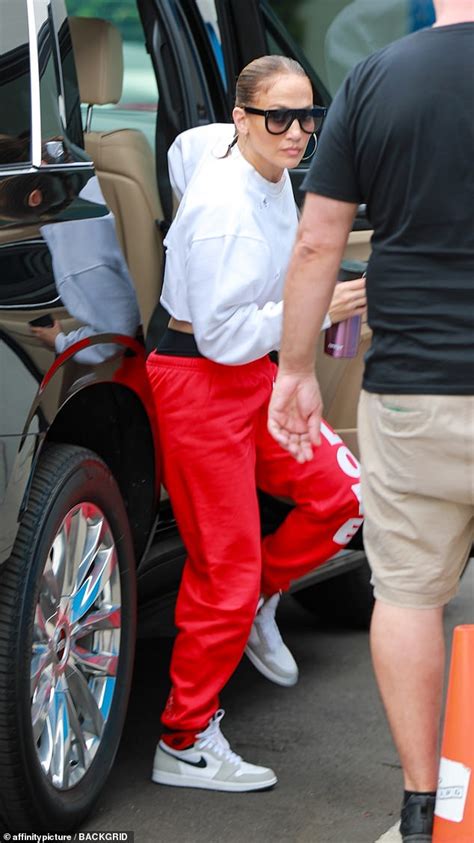 Jennifer Lopez Looks Casual Chic In A Cropped Sweatshirt And Bright Red