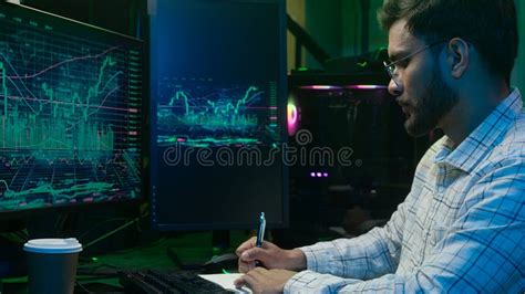 Indian Arabian Man Writing Notes Notebook Working With Pc Computer