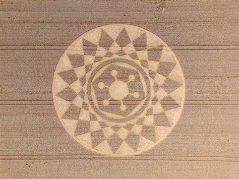Aerial View Of An Intricate Geometric Crop Circle Formation In A Wheat