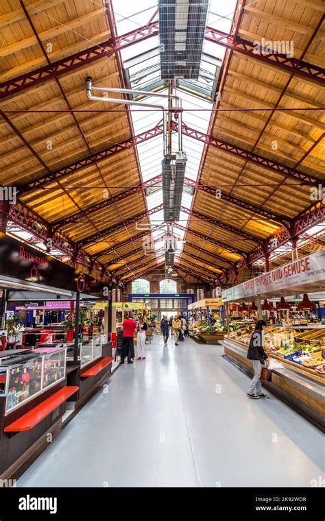 COLMAR, FRANCE - JULY 3, 2013: people shop in the old market hall in ...