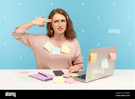 Depressed Overworked Woman Employee In Nerd Eyeglasses Sitting At