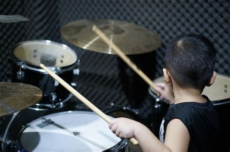 Premium Photo Boy Playing Drum At Home