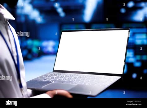 manager inspecting server rackmounts doing intense computations supervisor using mock up tablet