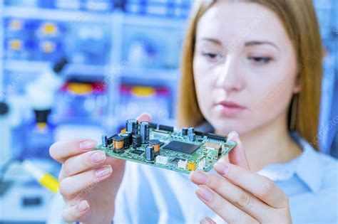 Woman Holding A Printed Circuit Board Stock Image F013 2065 Science Photo Library