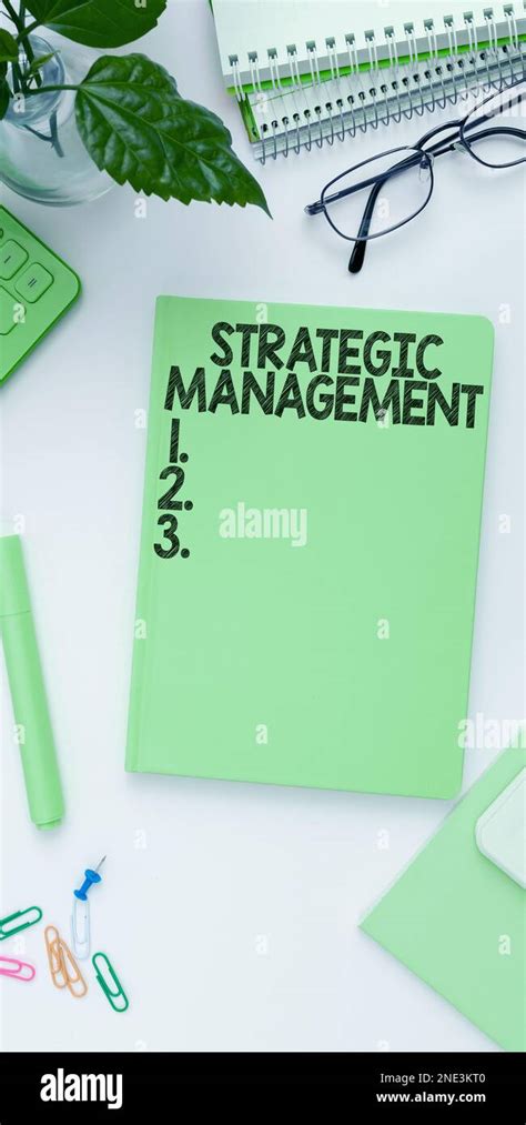 Hand Writing Sign Strategic Management Word For Formulation And Implementation Of The Major