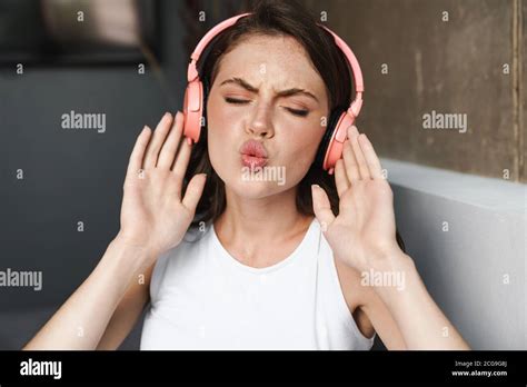 Image Of Beautiful Nice Woman Making Kiss Lips And Using Wireless
