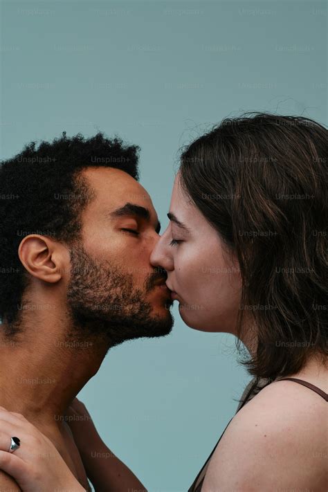 A Man And A Woman Kissing Each Other Photo Kissing Lips Image On Unsplash