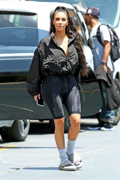 Kim Kardashian Wears Yeezy Slides With Socks Details