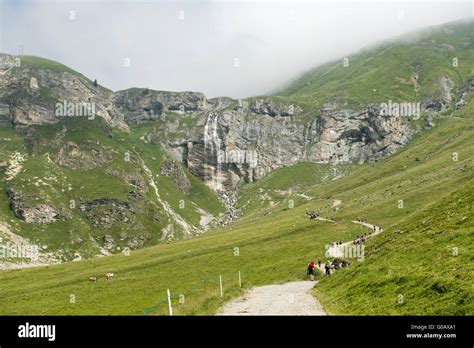 Group Of Hiker Bevore Waterfall In Schlinig Valley Stock Photo Alamy