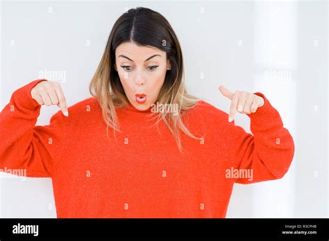 Young Woman Wearing Casual Red Sweater Over Isolated Background
