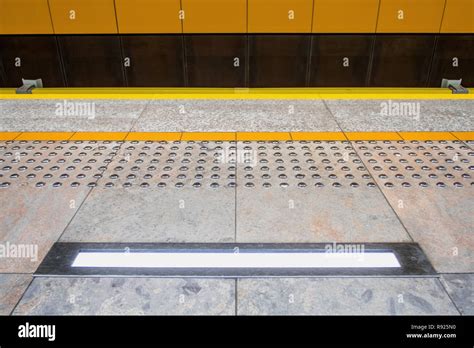 Tactile Paving Also Called Detectable Warning Surfaces To Assist