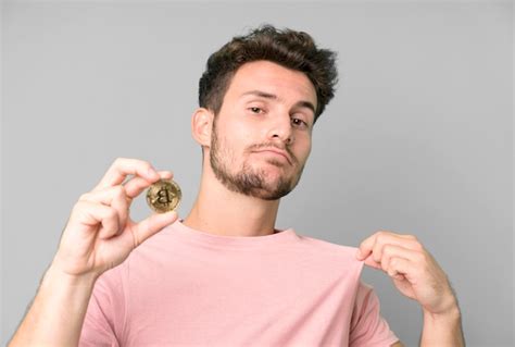 Premium Photo Young Handsome Isolated Man With A Bitcoin Coin