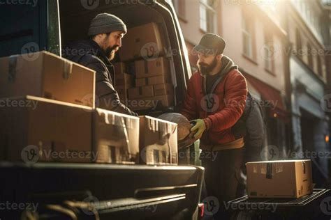A Man Loading A Van Loading Boxes With An Unloading Truck With 25663784 Stock Photo At Vecteezy