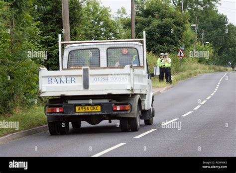 Police Officers With A Hand Held Laser Speed Camera Detector Stock