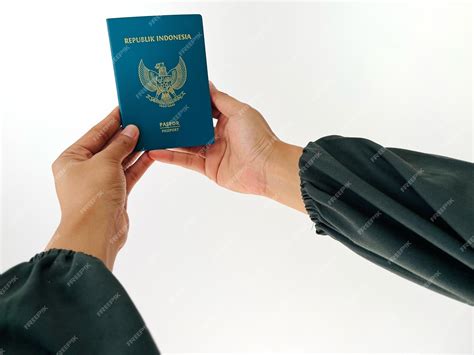 Premium Photo A Woman Hand Is Holding An Indonesian Passport Isolated