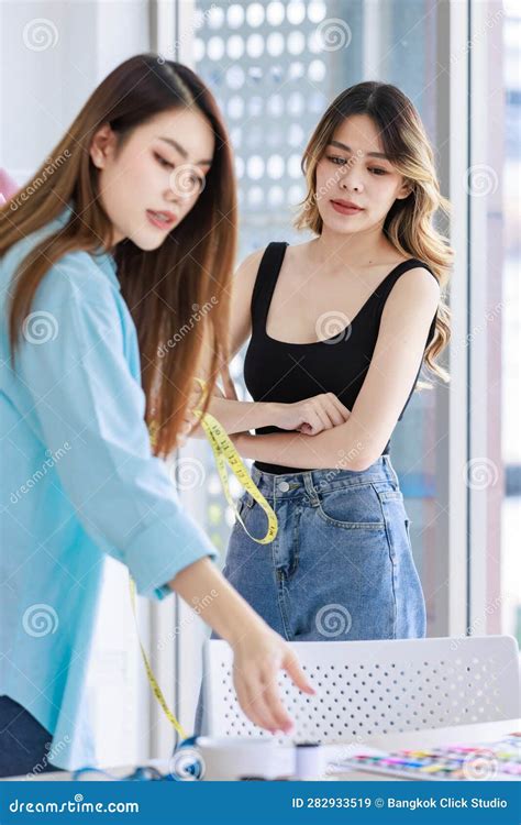 Millennial Asian Young Beautiful Female Customer In Black Tank Top And