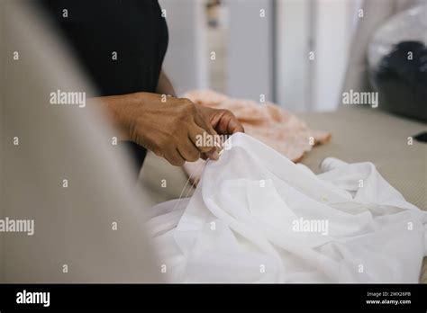 Woman Selecting Fabrics In Clothing Manufacturing Process Fitting Room