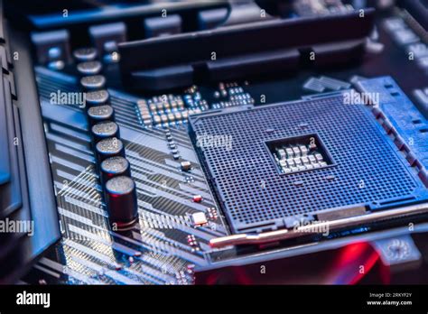 AM CPU Socket On Motherboard Of Modern Powerful PC Computer Hardware Chipset Close Up In Blue