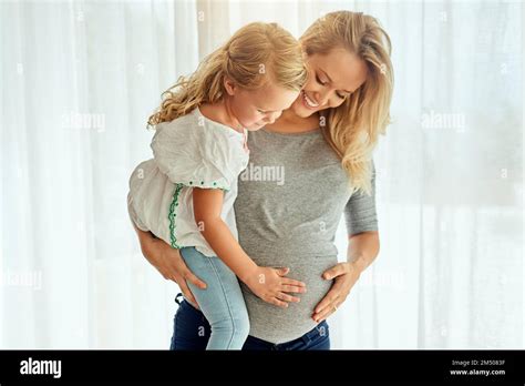 Theres More Than Enough Love For Both Of Them A Pregnant Woman Spending Time With Her Little