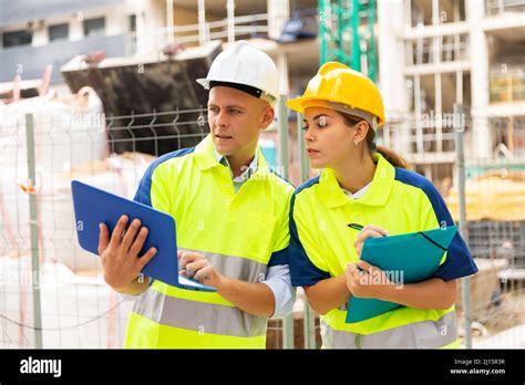 Male And Female Engineers In Construction Area Stock Photo Alamy