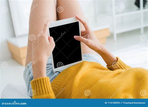 Young Asian Woman Using Tablet Mock Up Blank Black Screen In Her