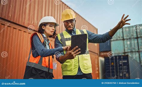 Multiethnic Female Industrial Engineer With Tablet And Black African American Male Supervisor In