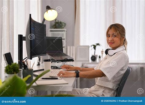 Young Female Developer Working With Coded Data On Computer Screen Developing Programming And