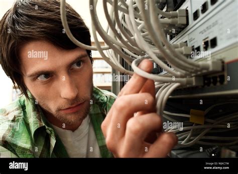 Engineer Connecting Network Cable Switch Hi Res Stock Photography And Images Alamy