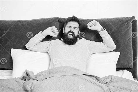 Sleepy Man Yawning And Stretching In Bed Waking Up After Sleep Morning Stock Image Image Of