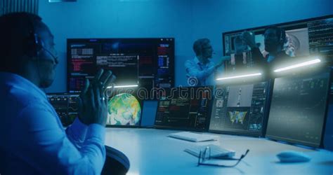 African American Flight Control Employee Monitors Space Mission Stock