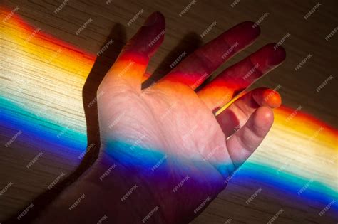 Premium Photo Rainbow Light As Diffraction On A Palm Creativity