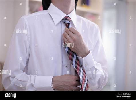 Man Adjusting His Tie Stock Photo Alamy