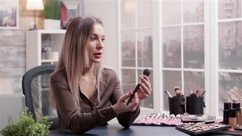 Beauty Blogger Making An Online Tutorial About Make Up And Showing How To Do It Stock