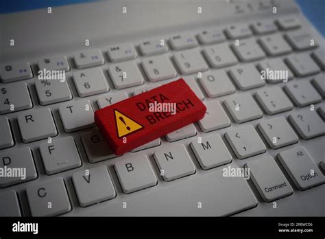 Close Up Image Of Computer Keyboard And Red Wooden Cube With Text Data