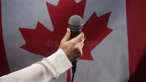Woman Singer Tv Presenter Holding Mic Mike Or Microphone In Hand On Canadian Flag Musical