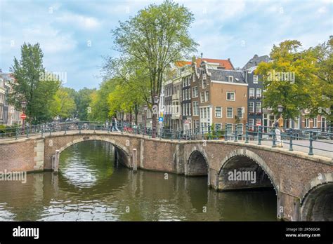 Netherlands Old Stone Bridges On The Amsterdam Canals Typical Dutch