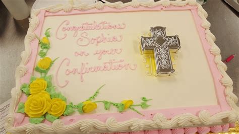 Confirmation Cake With Floral Decorations And Cross
