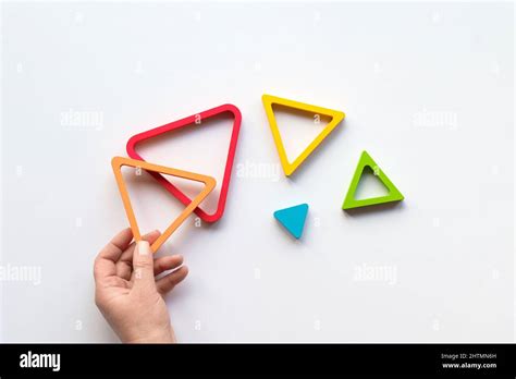 Hand With Triangle Nested Wood Triangles Concentric Educational Figures Stacking Puzzle Stock