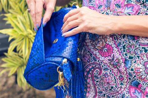 Premium Photo Handmade Bag Made Of Exotic Python Skin In The Hands Of