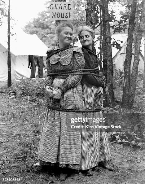Two Mature Women Are Tied Up To A Tree On A Camping Trip Ca 1905 News